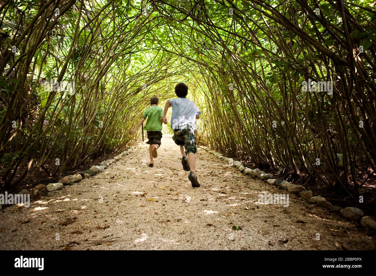 Boys running through field hi-res stock photography and images - Alamy
