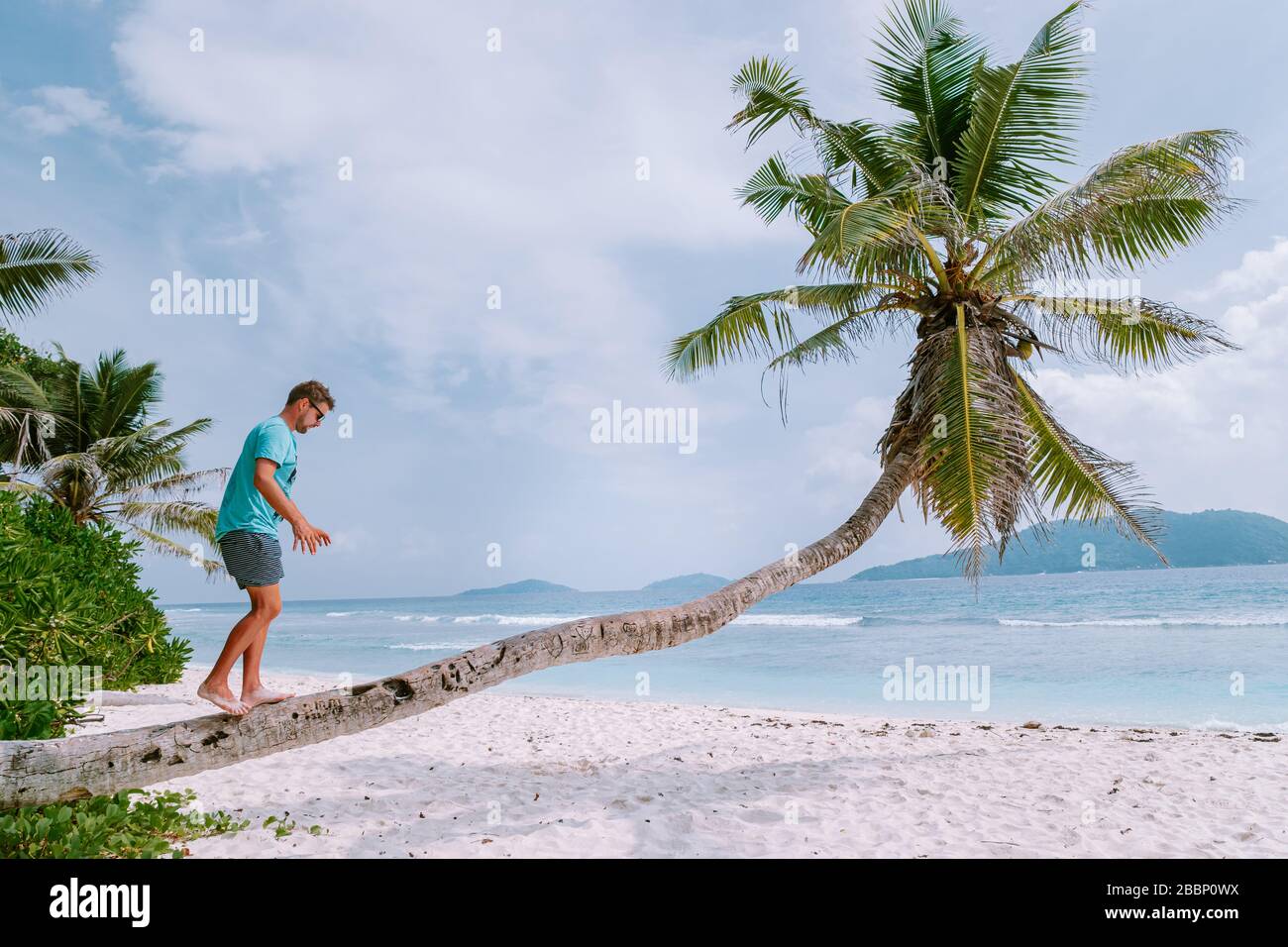 La Digue Seychelles, young men on vacation at the tropical Island La ...
