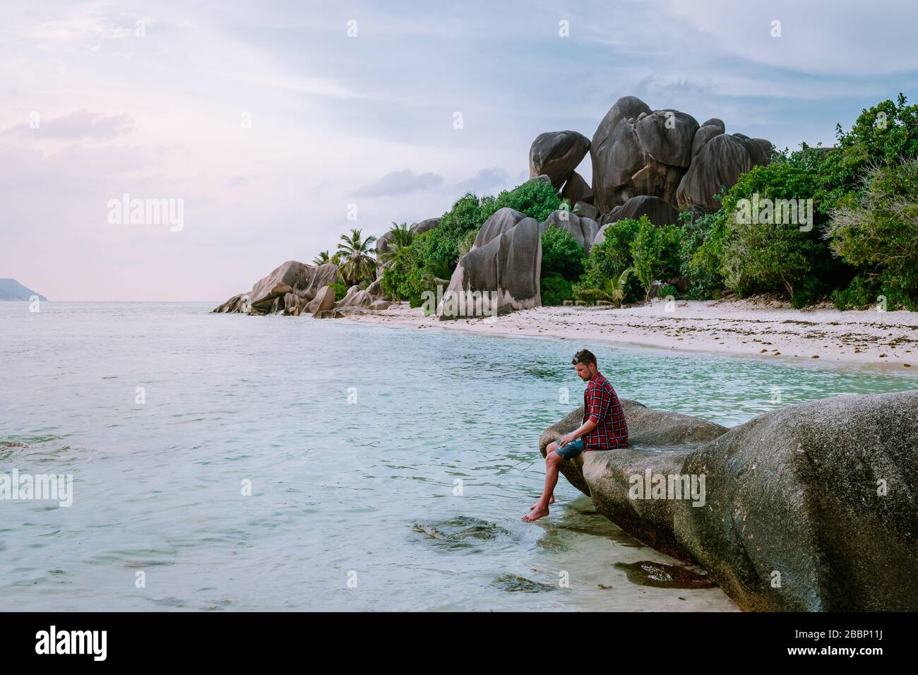La Digue Seychelles, young men on vacation at the tropical Island La ...