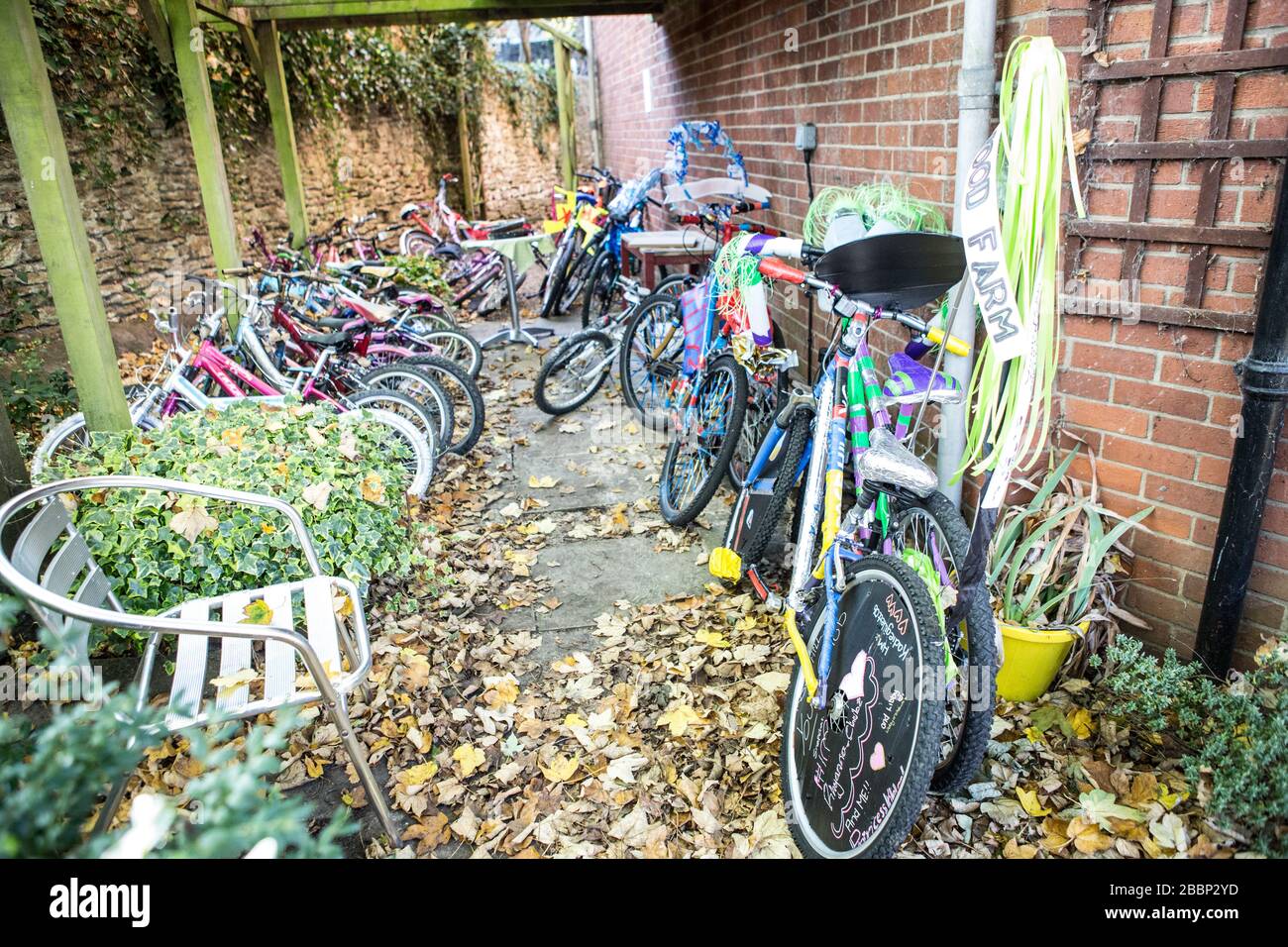 Group of colourful bicycles lined up together Stock Photo - Alamy