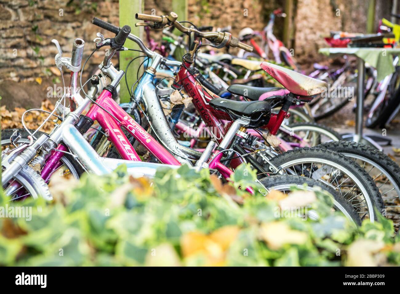 Group of colourful bicycles lined up together Stock Photo - Alamy