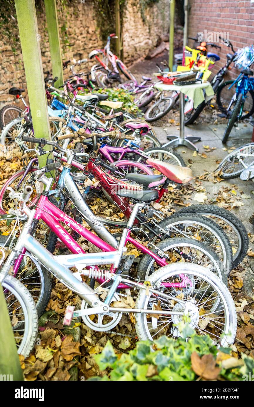 Group of colourful bicycles lined up together Stock Photo - Alamy
