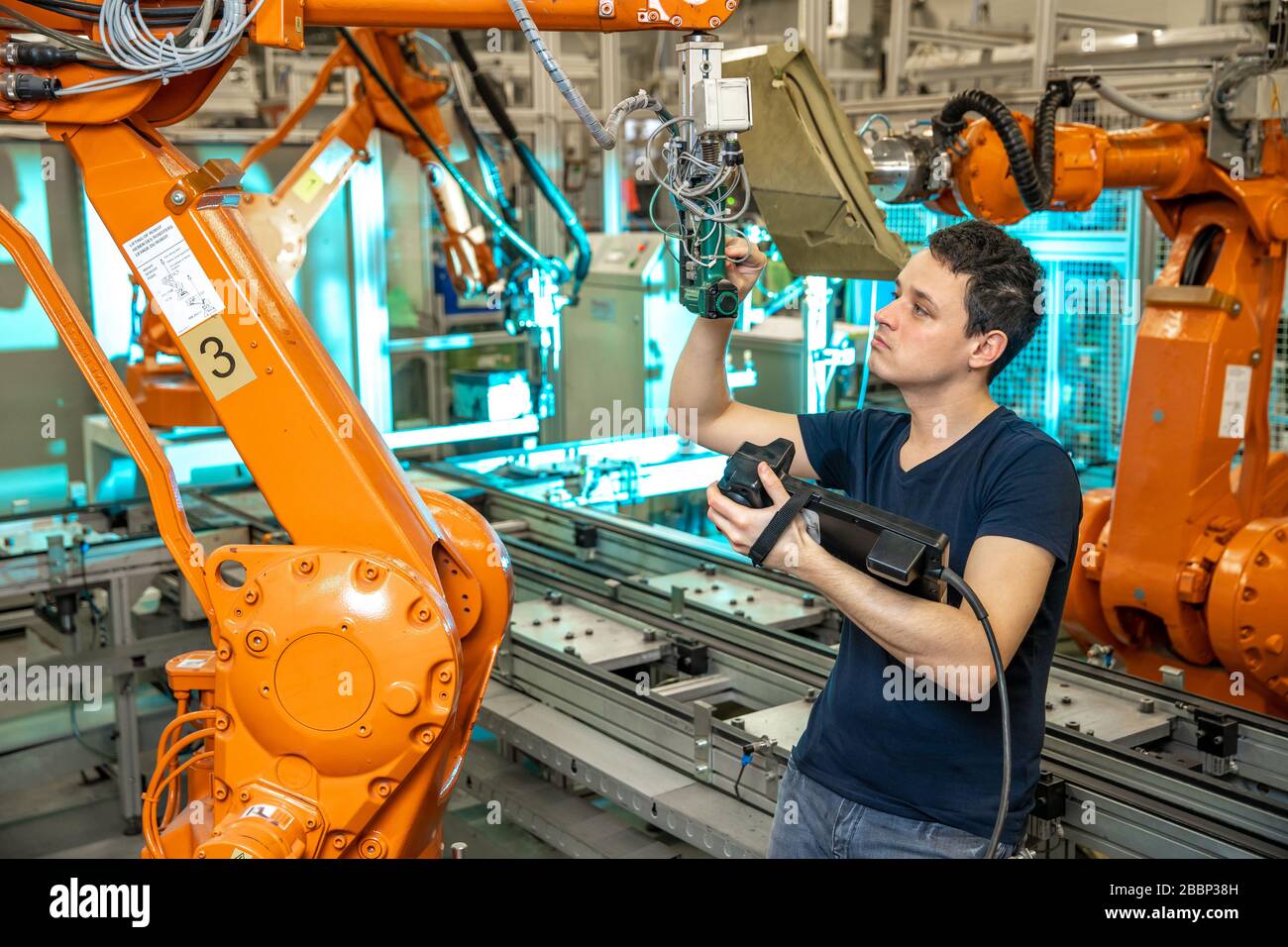 Man engineer programming robot tablet hi-res stock photography and ...