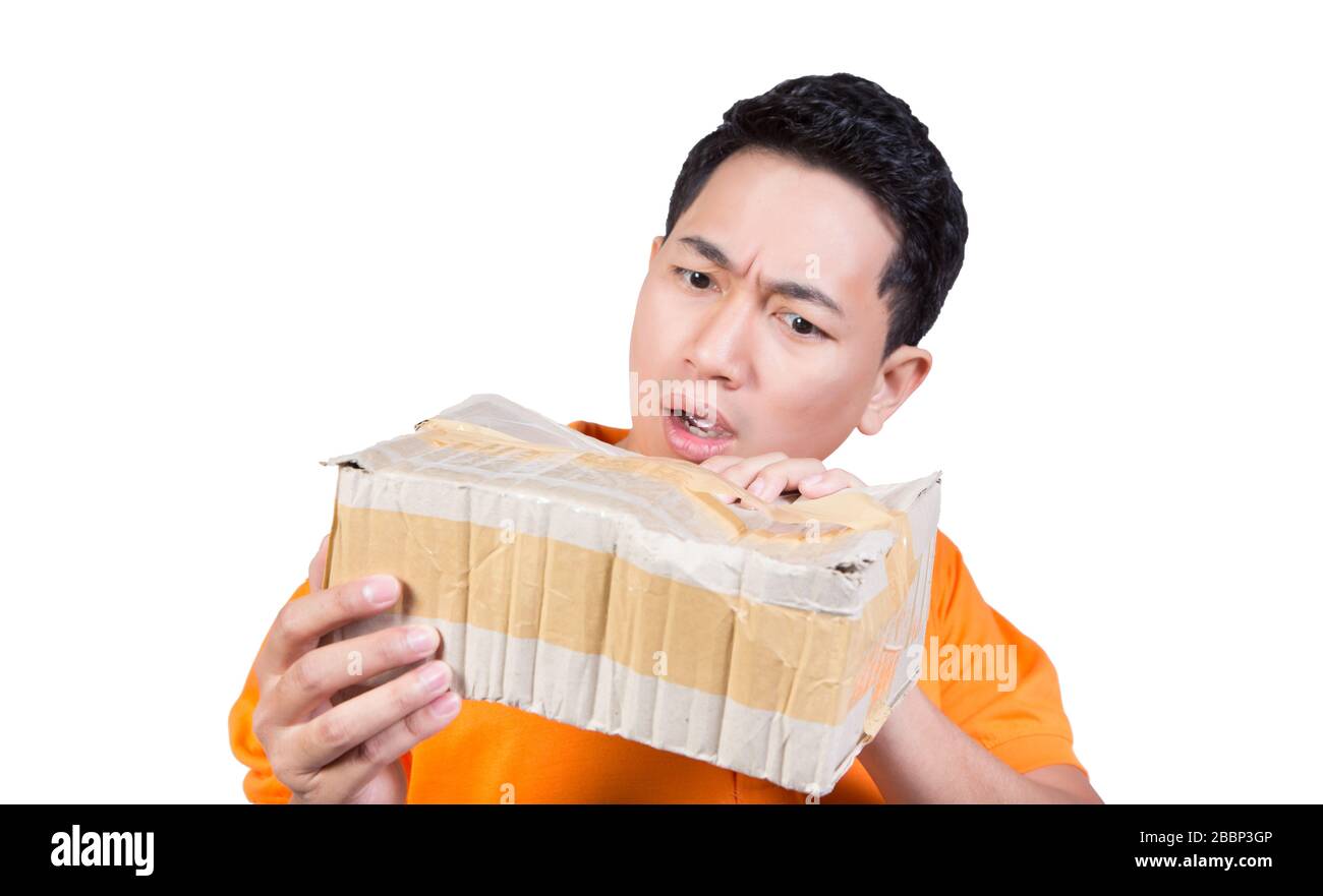 delivery man hand holding damaged box package shocking expression Stock ...
