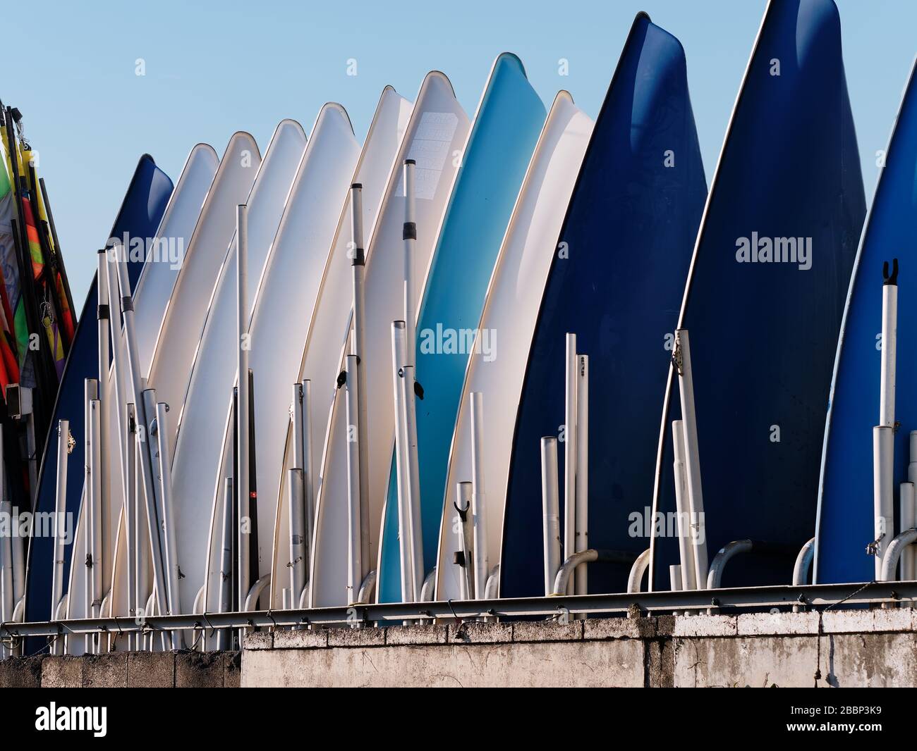 Colorful Laser Sailboats in the storage rack of a marina. Day sailing ...