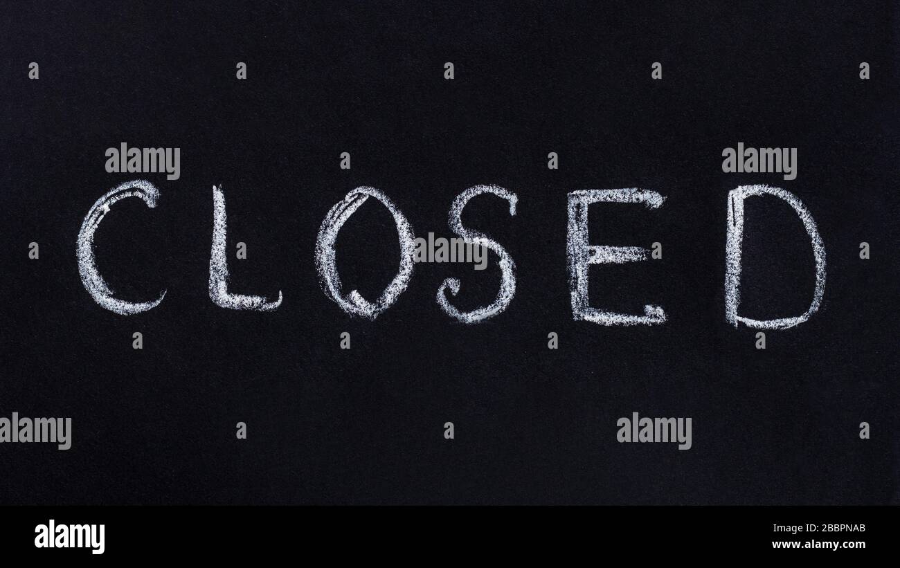 Drawing with chalk on a black blackboard, handwritten text closed Stock ...