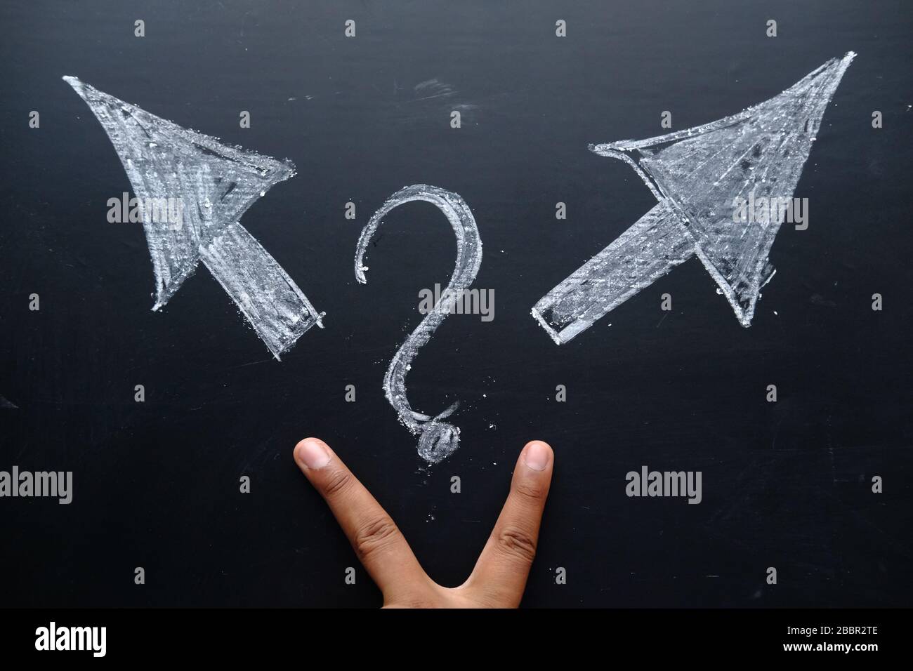 finger and arrows pointing in different directions on floor, choice in ...