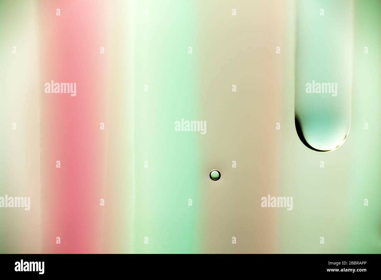 Slowly dripping green and red transparent liquid Stock Photo - Alamy