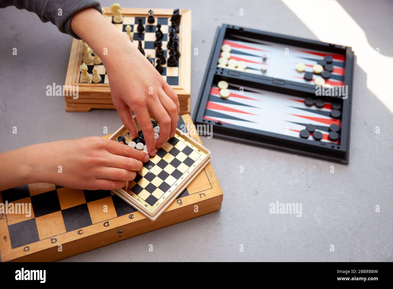 Board games on the table. Chess, backgammon, checkers. Boards are laid ...