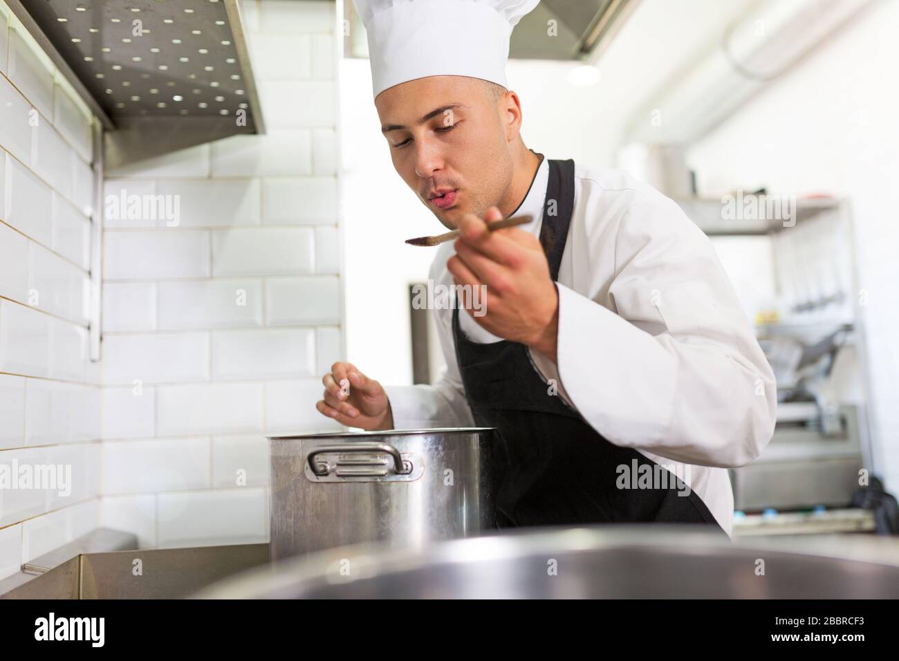 Professional chef in industrial kitchen Stock Photo - Alamy