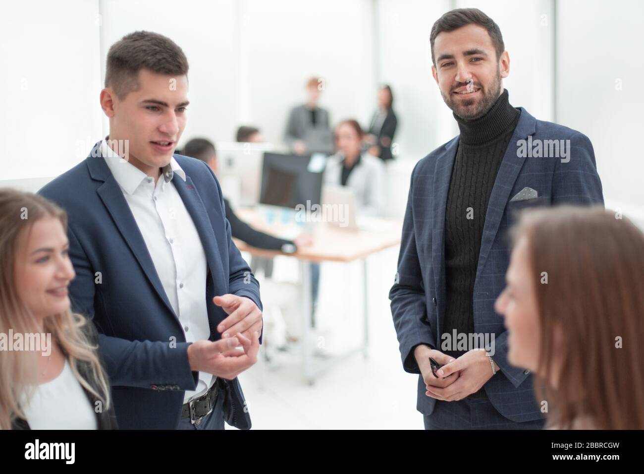 business people discuss something standing in the office Stock Photo ...