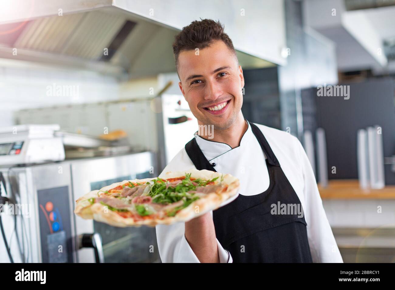 Professional chef in industrial kitchen Stock Photo - Alamy