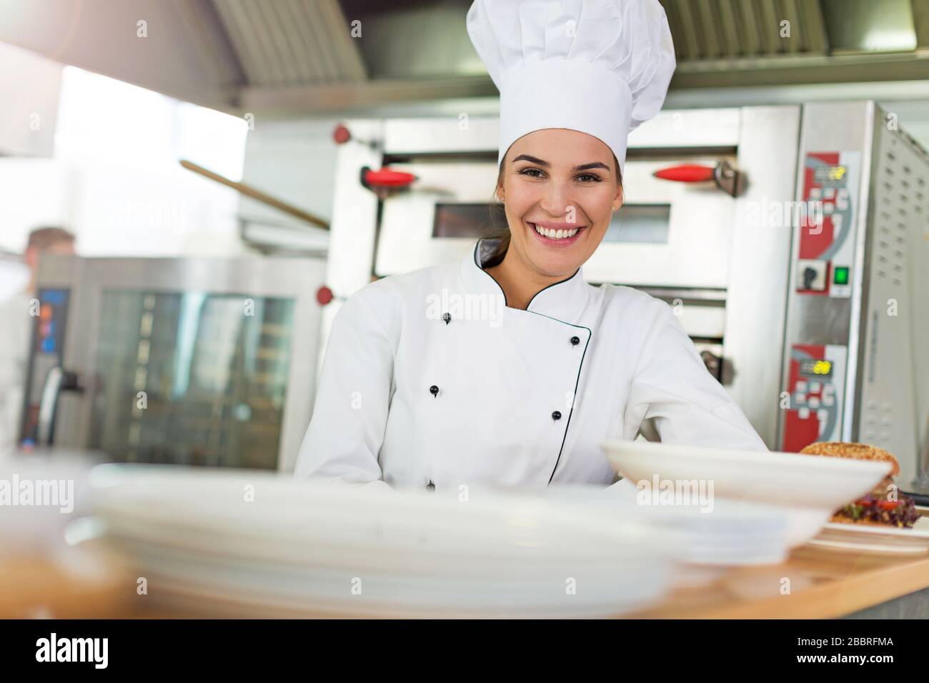 Smiling female restaurant hi-res stock photography and images - Alamy