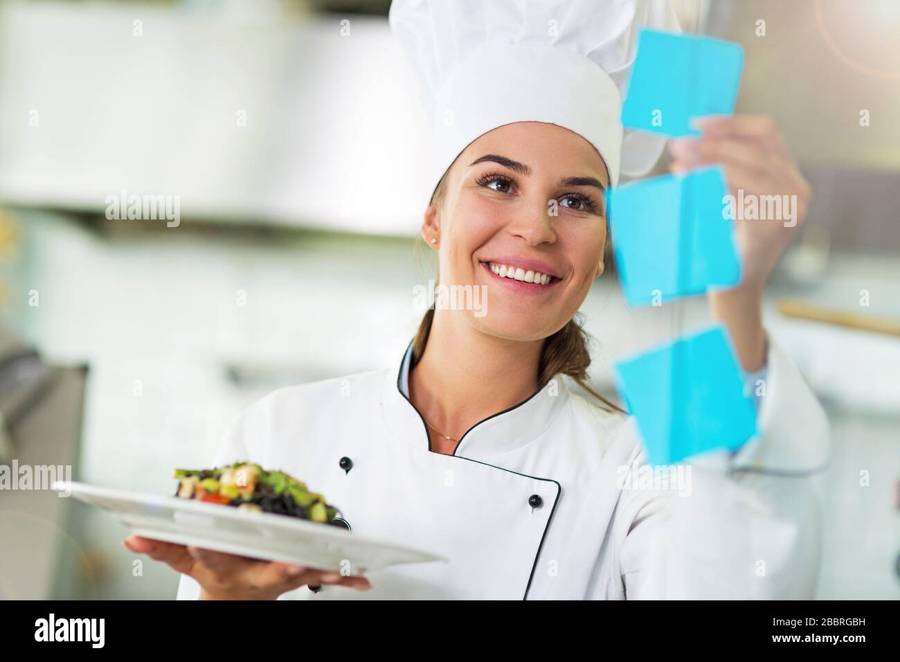 Female chef in kitchen Stock Photo - Alamy