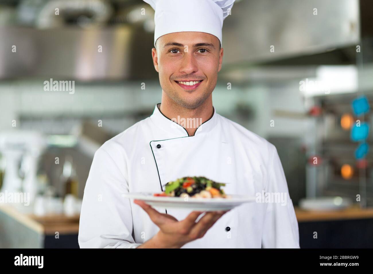 Professional chef in industrial kitchen Stock Photo - Alamy