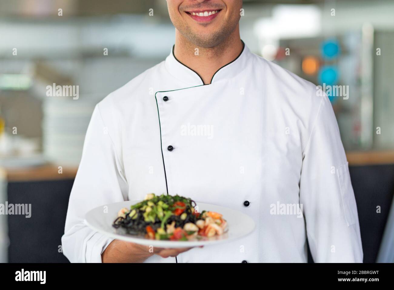 Professional chef in industrial kitchen Stock Photo - Alamy