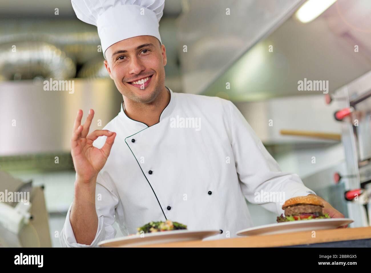 Professional chef in industrial kitchen Stock Photo - Alamy
