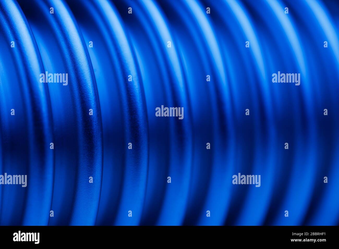 Close-up of a blue corrugated pipe or tube of steel - selective focus ...