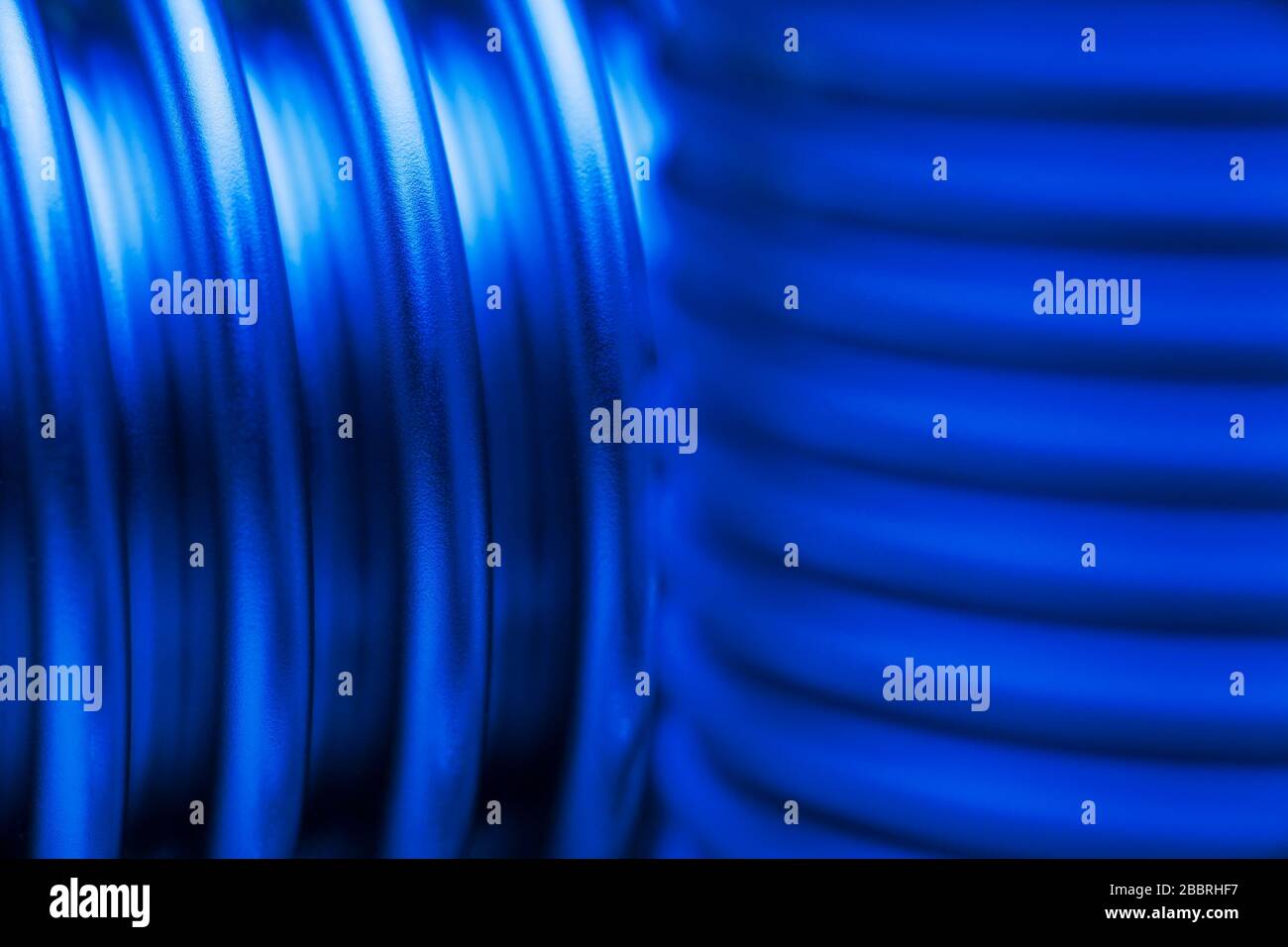 Close-up of a blue corrugated pipes or tubes of steel - selective focus ...