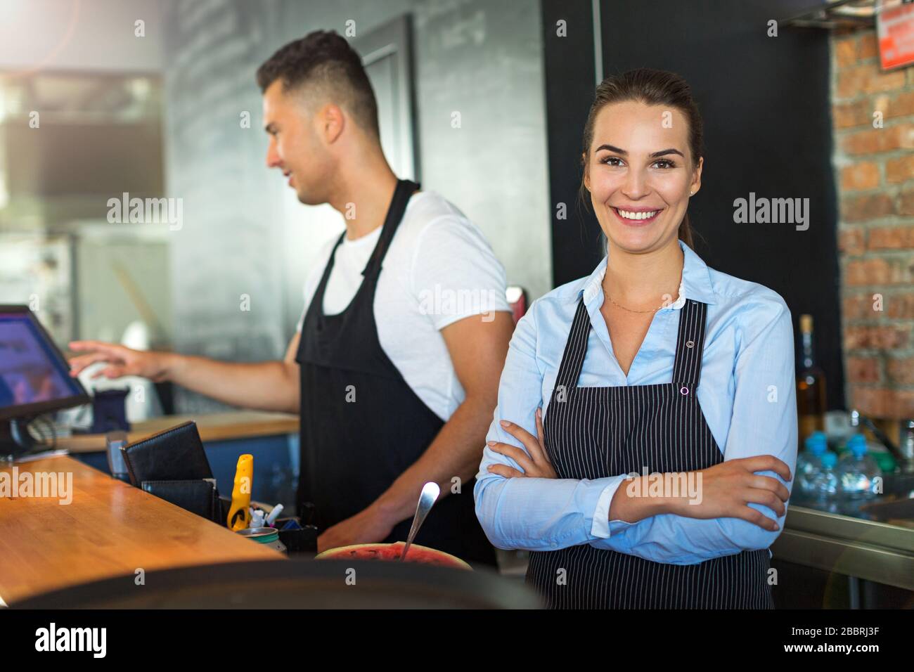 Woman and man working at cafe Stock Photo - Alamy