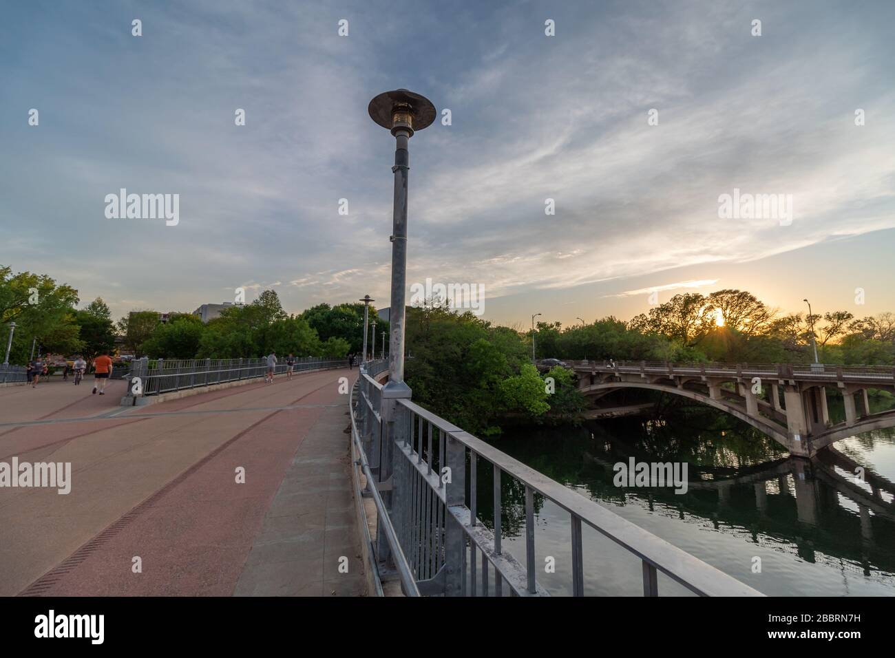 View of Pedestrian Bridge Looking Towards Sunset Stock Photo - Alamy