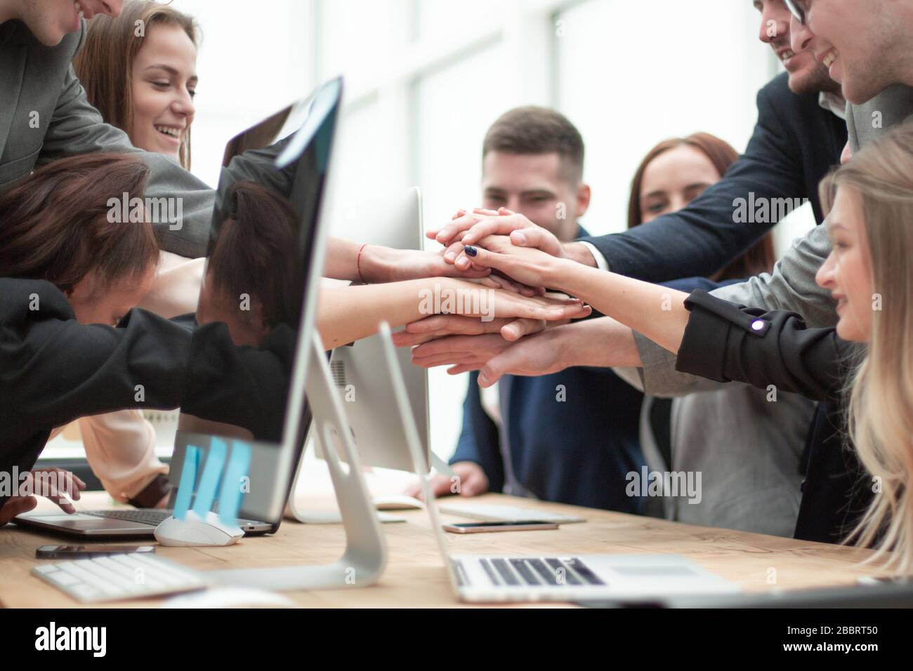 Business people forming hands stack hi-res stock photography and images ...