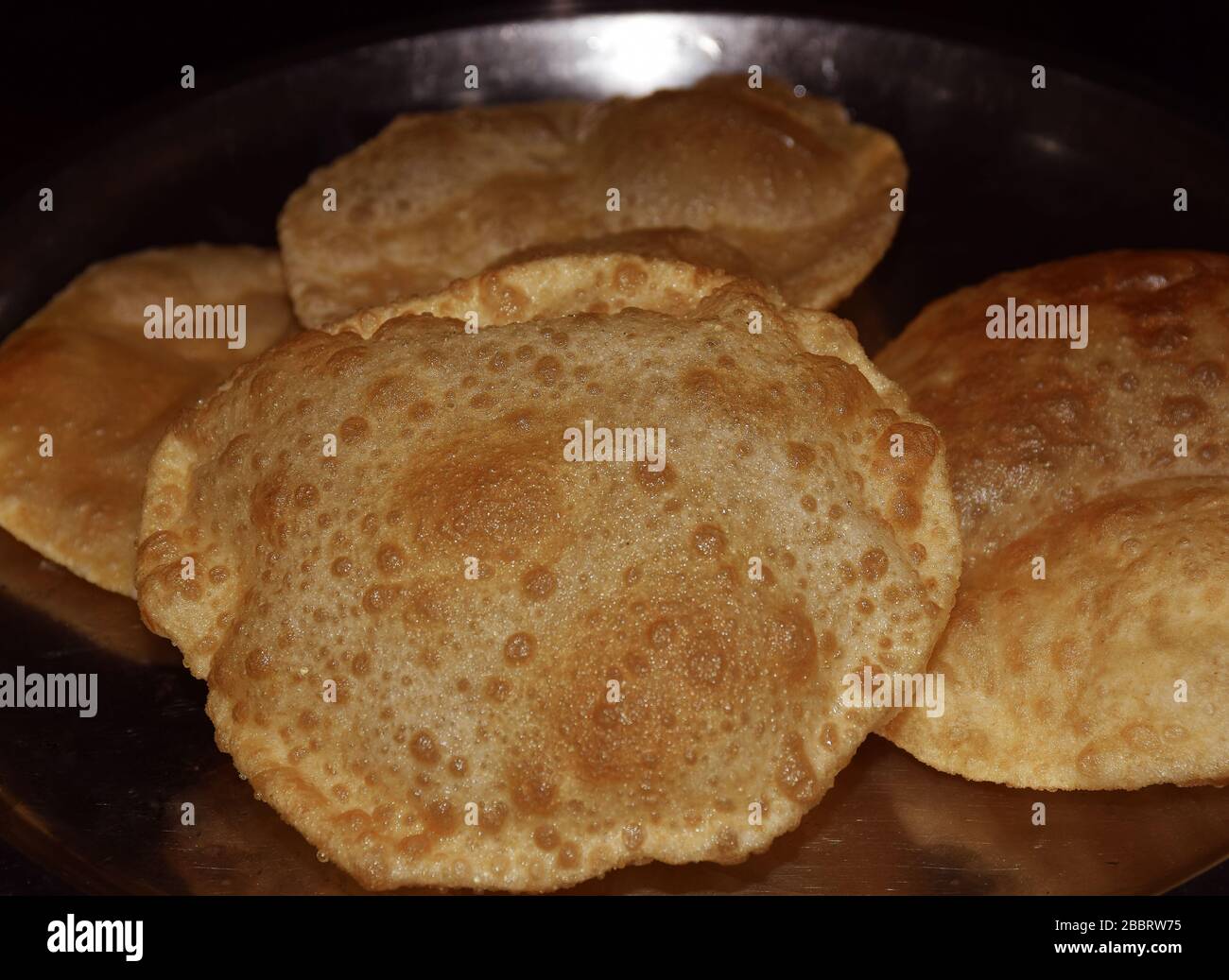 Bengali Luchi close up it is also called as Poori in India. Deep fried ...