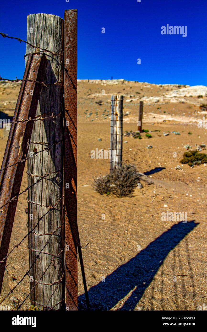 fence in the desert Stock Photo - Alamy