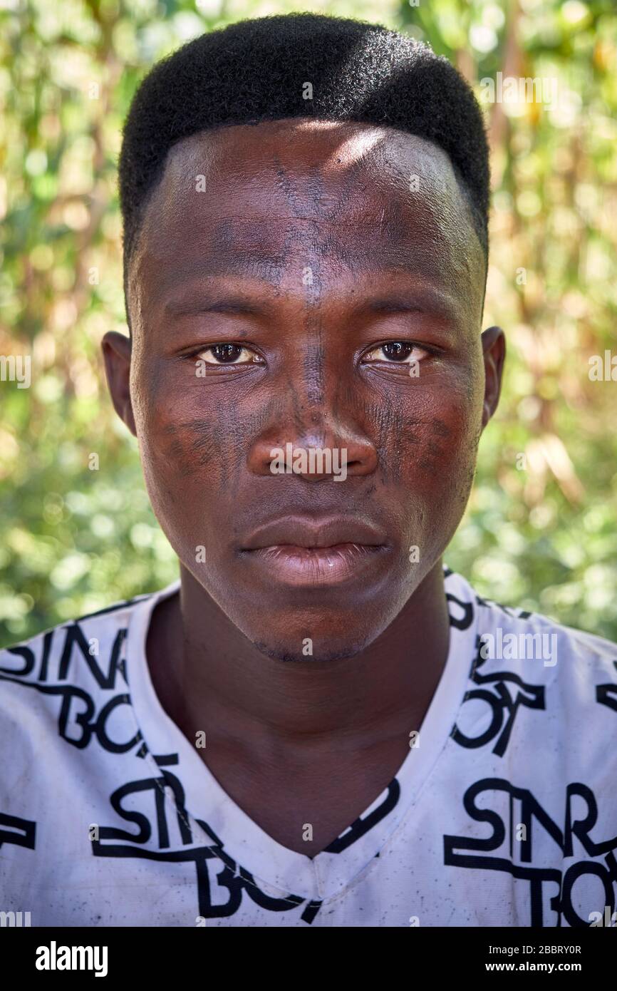 Portrait of a young Fulani man with facial tattoos Stock Photo - Alamy