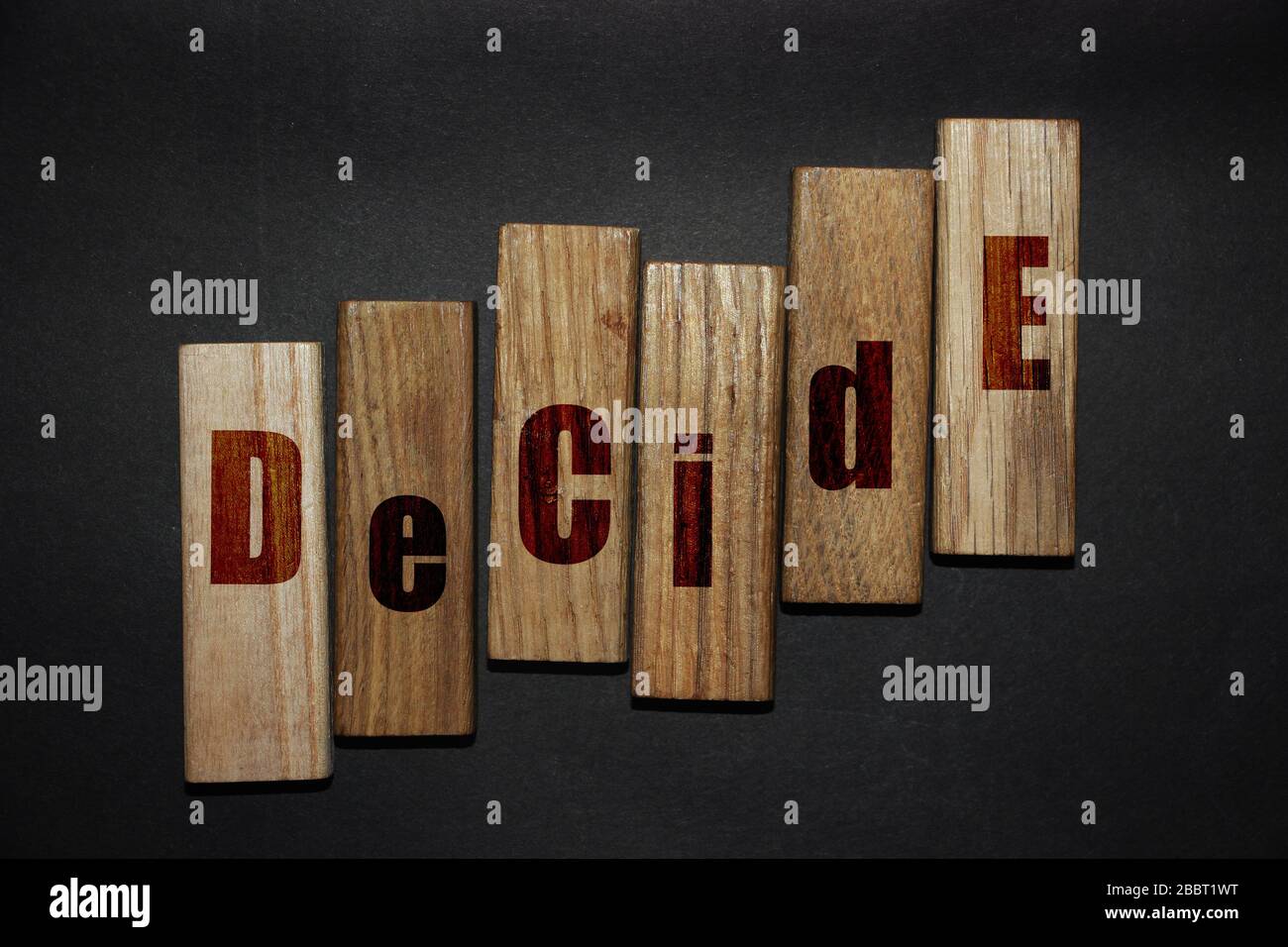 Decide word letters written on wooden blocks. Motivational business ...