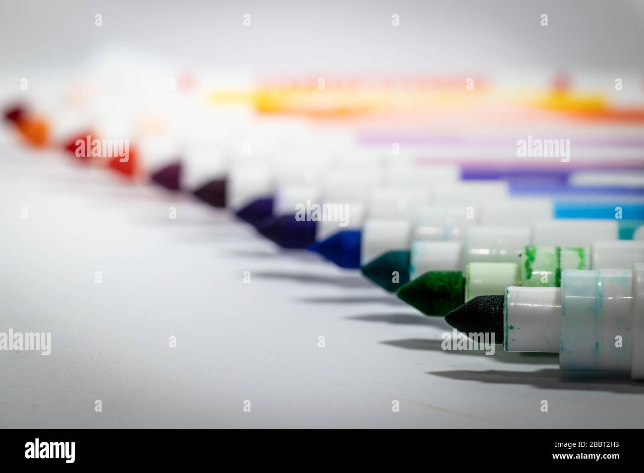 Markers in all rainbow colors, white background Stock Photo - Alamy