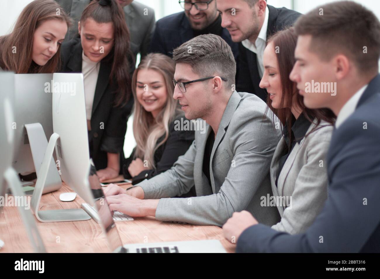 project Manager and the working group looking at the computer screen ...