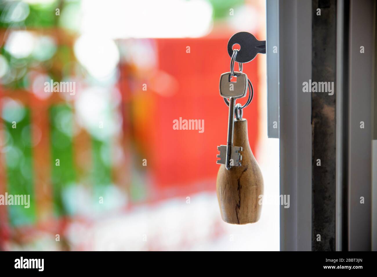 Close-up photography of key in keyhole of modern door Stock Photo - Alamy