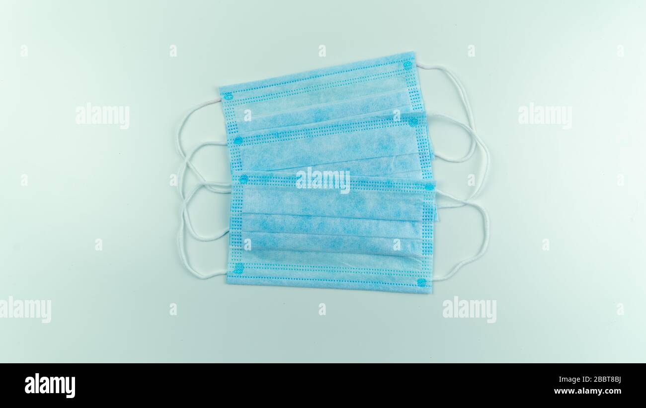 surgical masks on a white background Stock Photo - Alamy