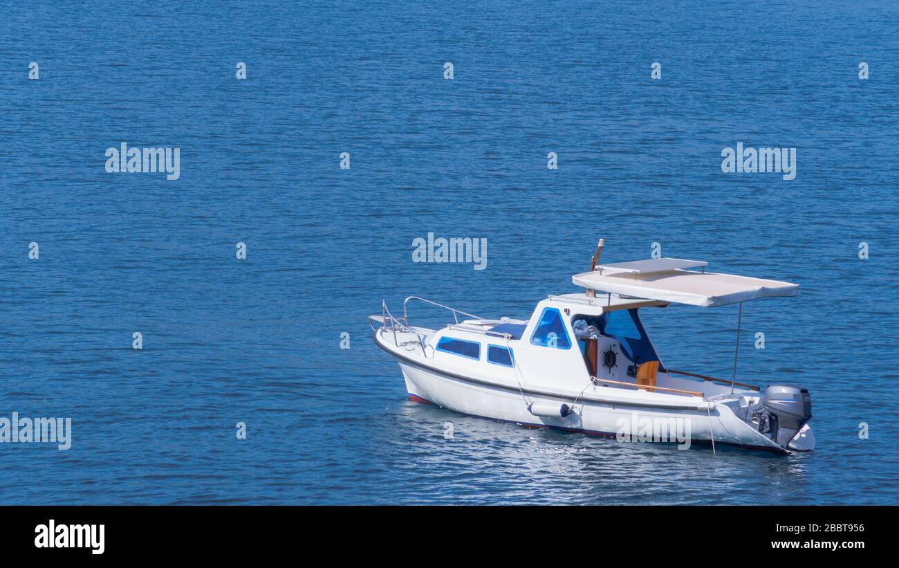 white boat in the blue sea Stock Photo - Alamy