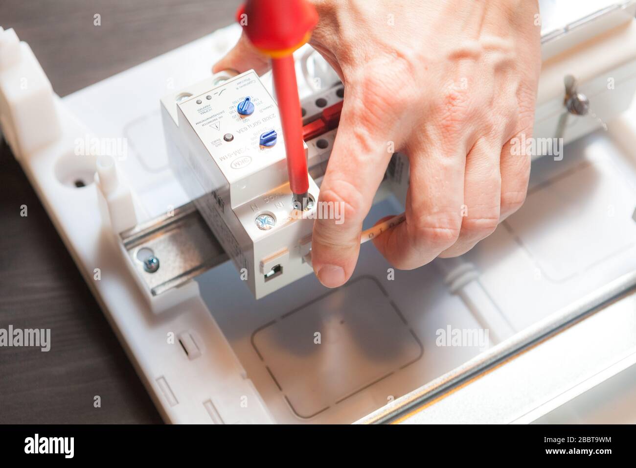 Men's hands close-up. Cleaning the cable. Installation of an electric ...