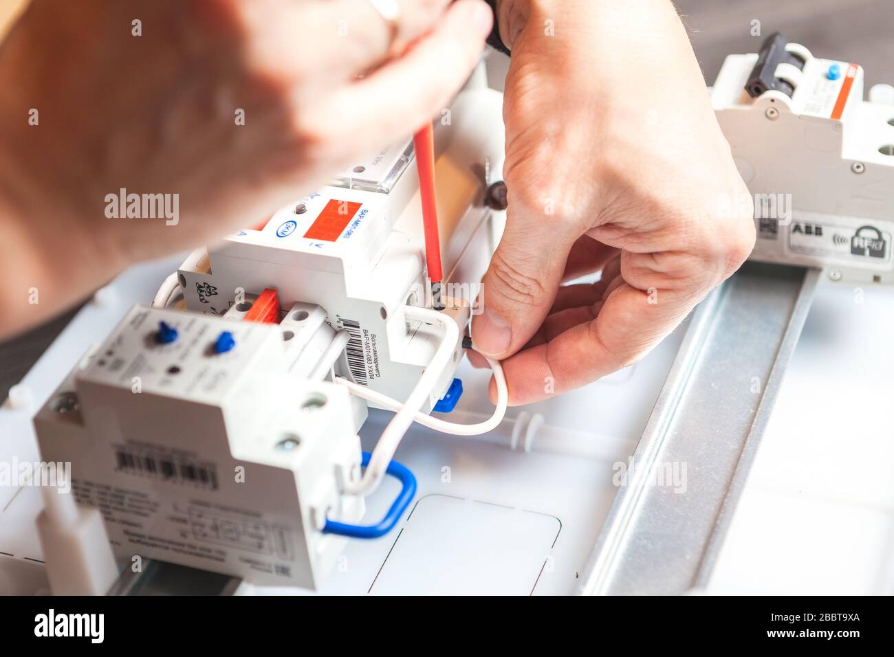 Men's hands close-up. Cleaning the cable. Installation of an electric ...