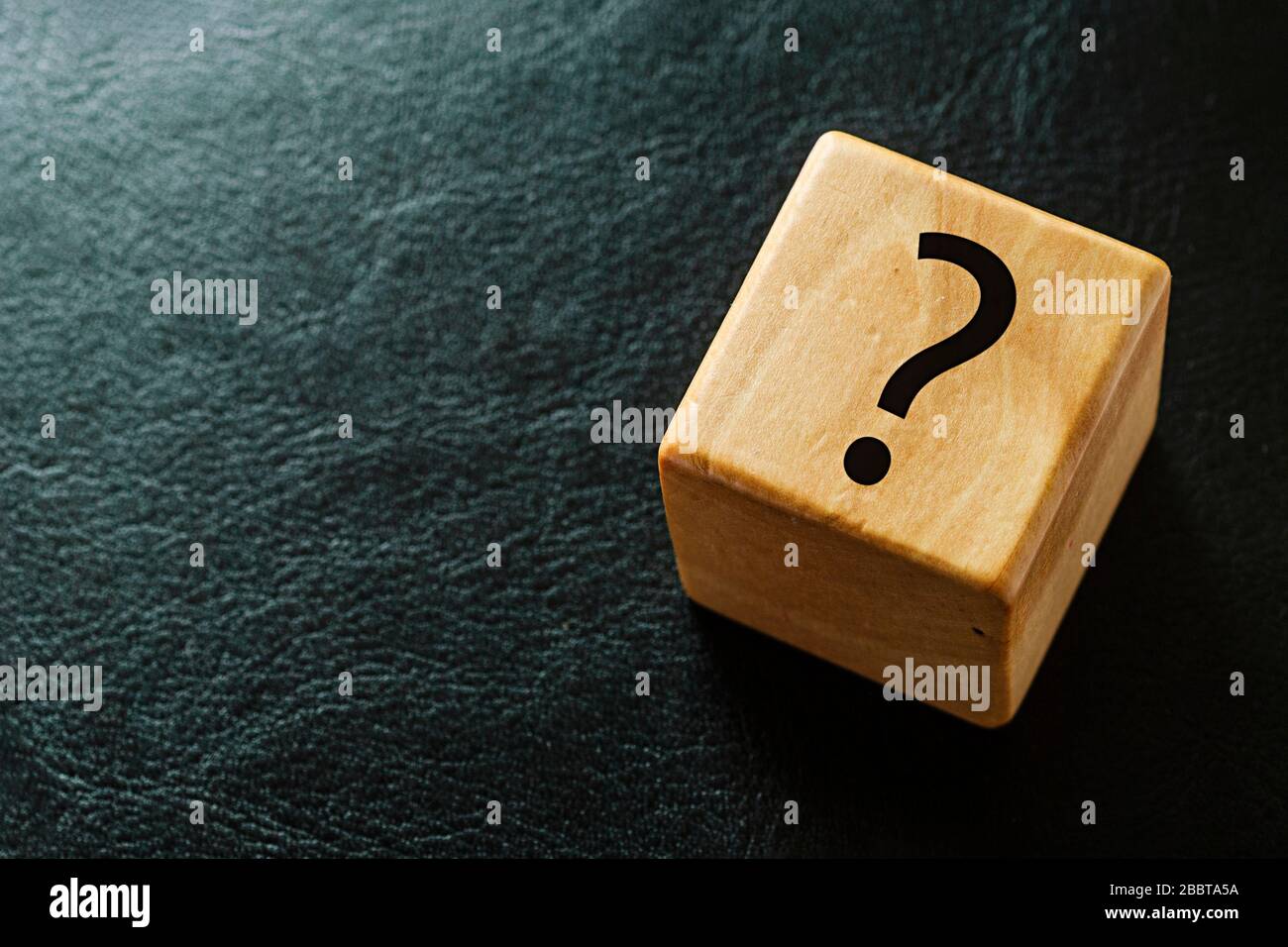Wooden cube black question hi-res stock photography and images - Alamy