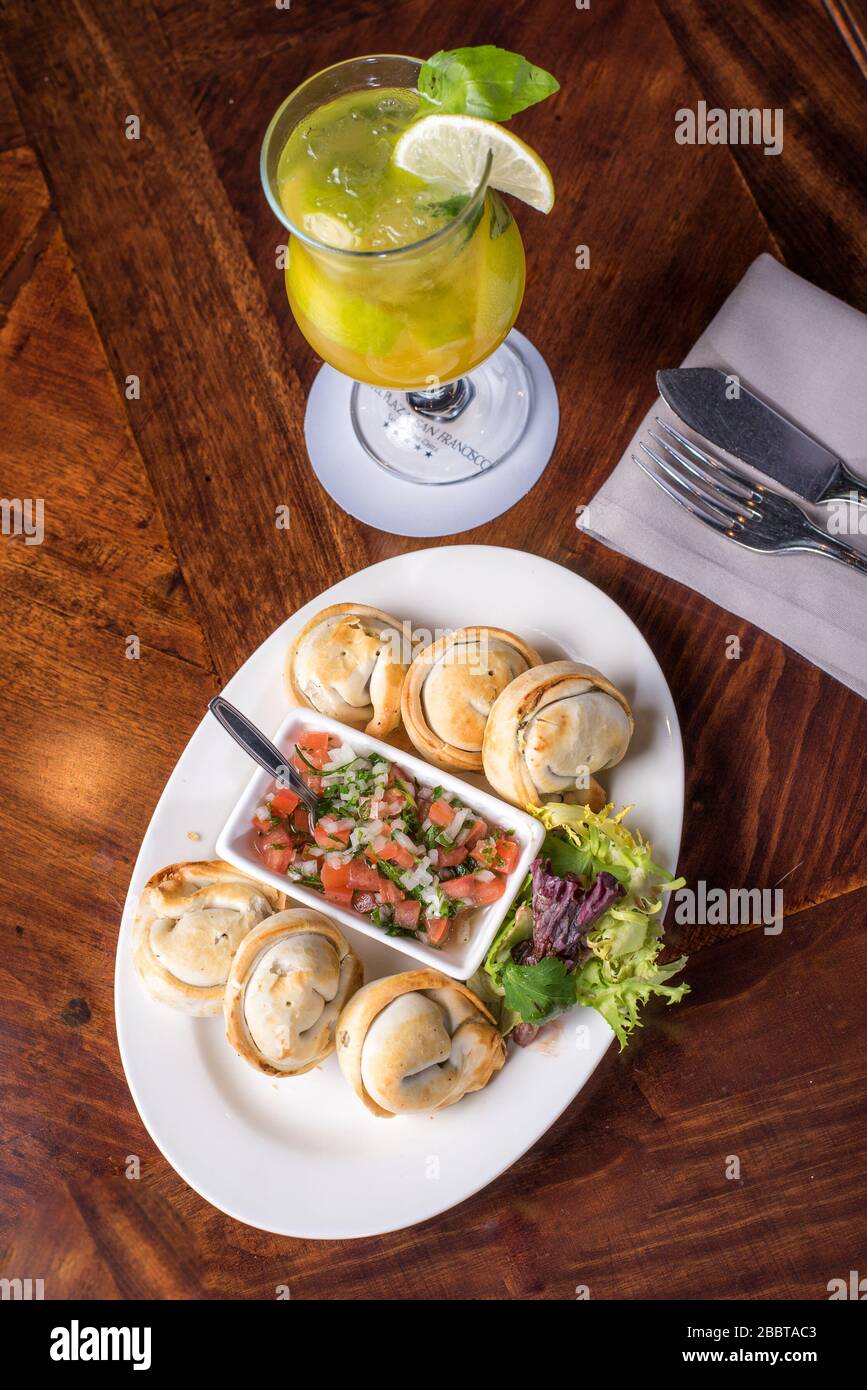 Meal in a bar - restaurant with some drinks Stock Photo - Alamy