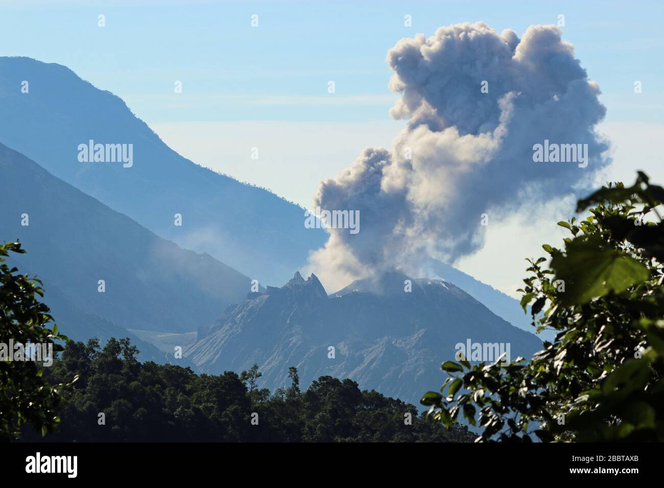 Eruption of Volcán Santa María viewed from Laguna Chicabal Stock Photo ...