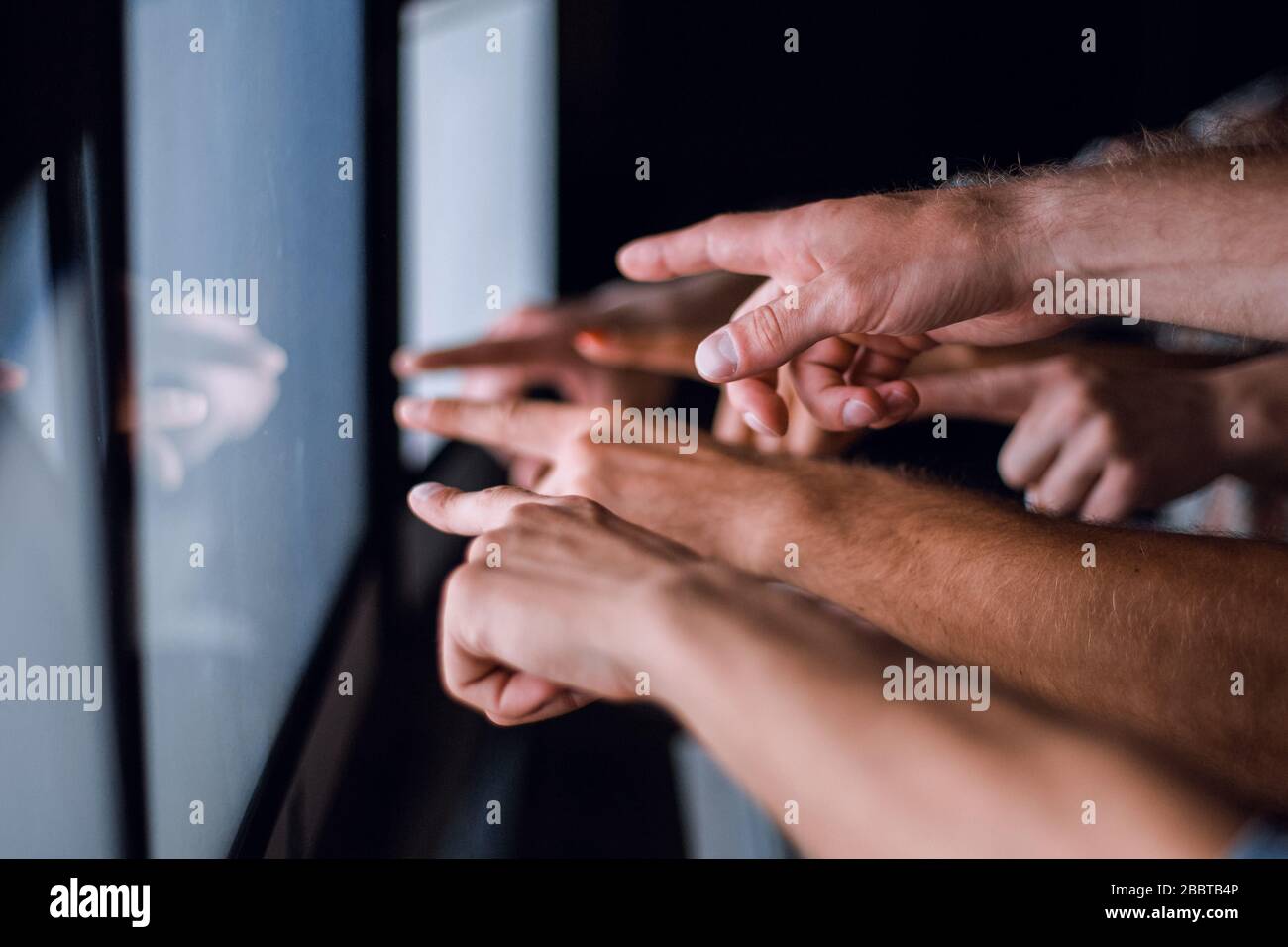 business team pointing their fingers at the computer screen Stock Photo ...