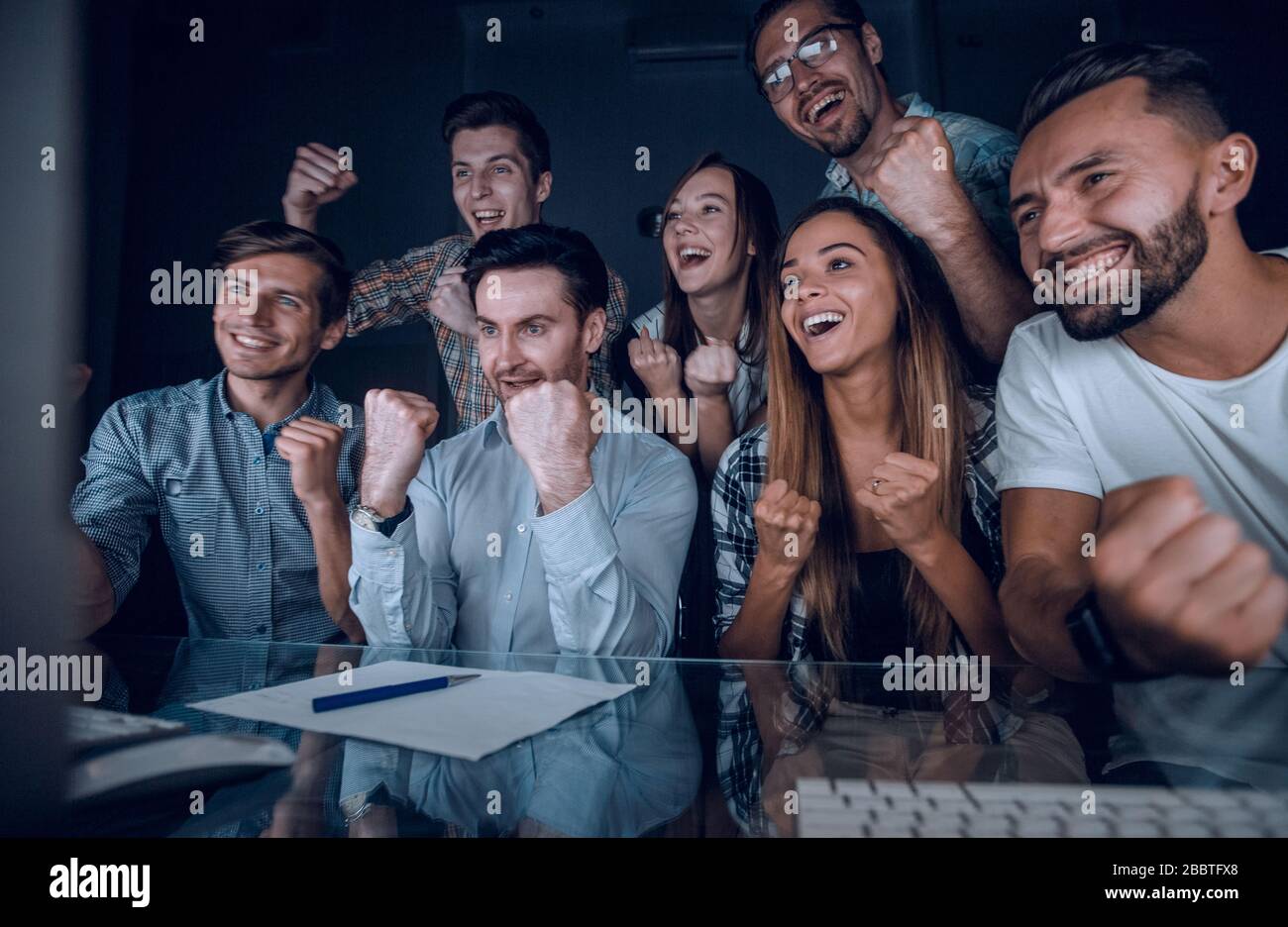 happy business team looking at computer monitor Stock Photo - Alamy