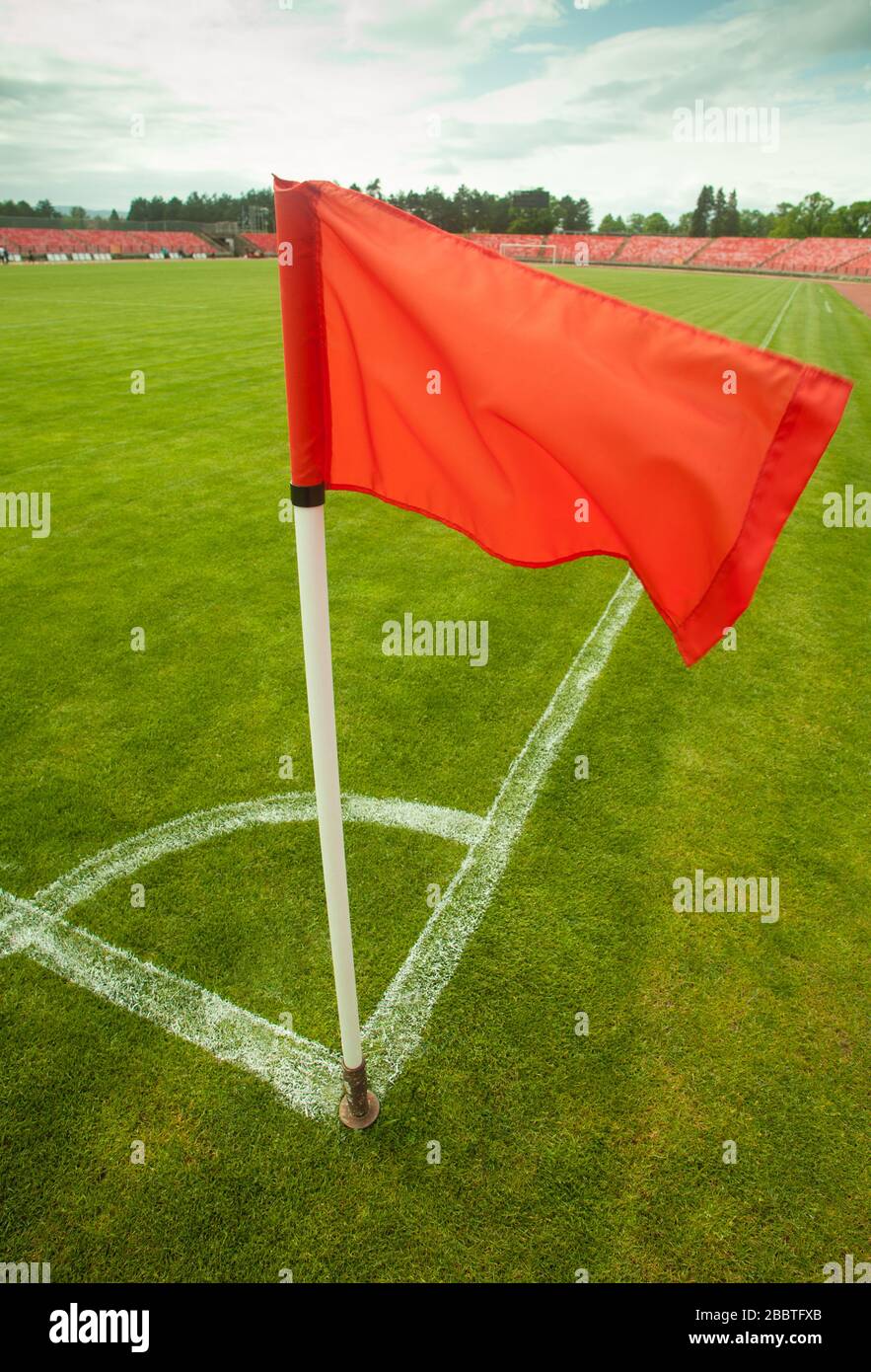 soccer field with a red corner flag pole Stock Photo - Alamy