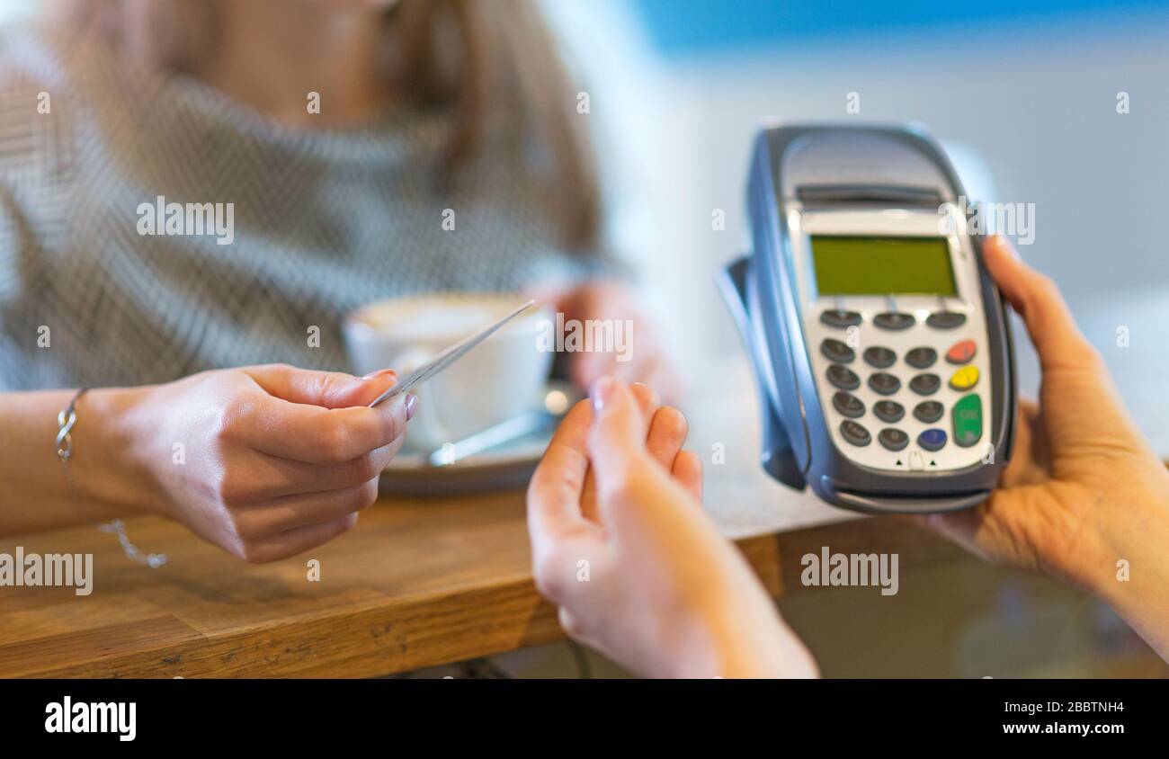 Paying for coffee Stock Photo - Alamy