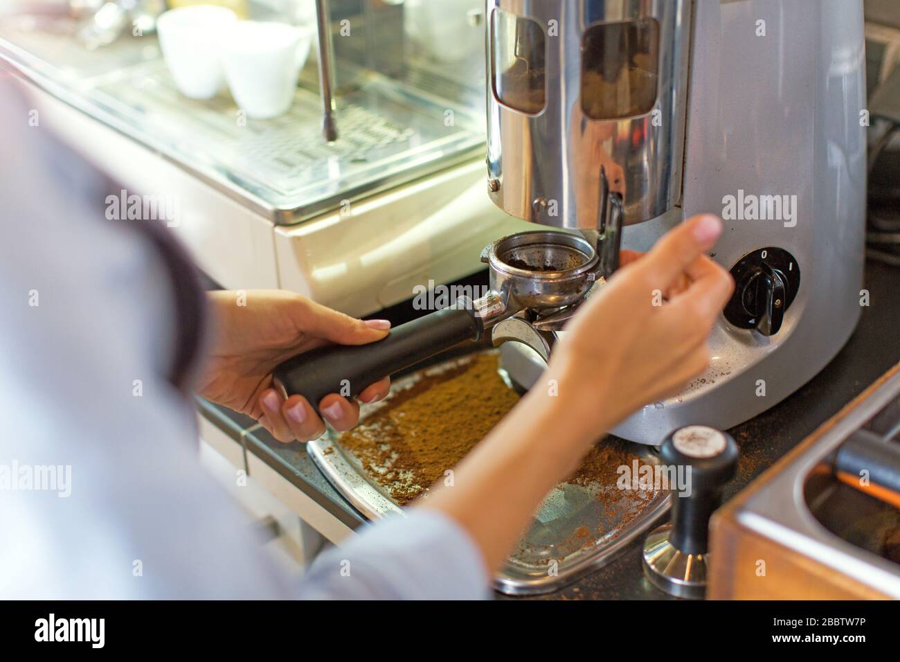 Female barista making coffee Stock Photo - Alamy
