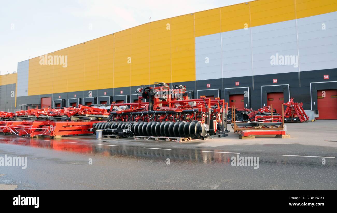 Storage of agricultural equipment in an open area of a warehouse ...
