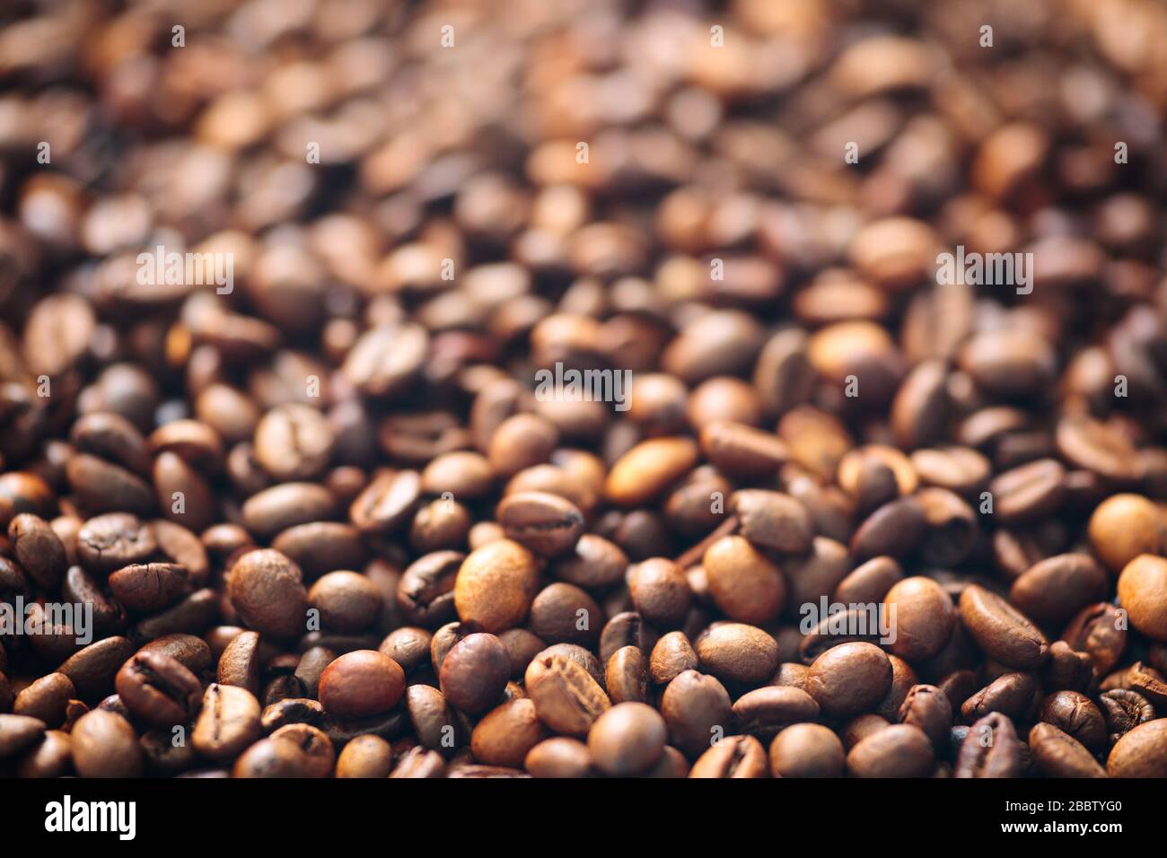 Coffee beans close-up texture background Stock Photo - Alamy