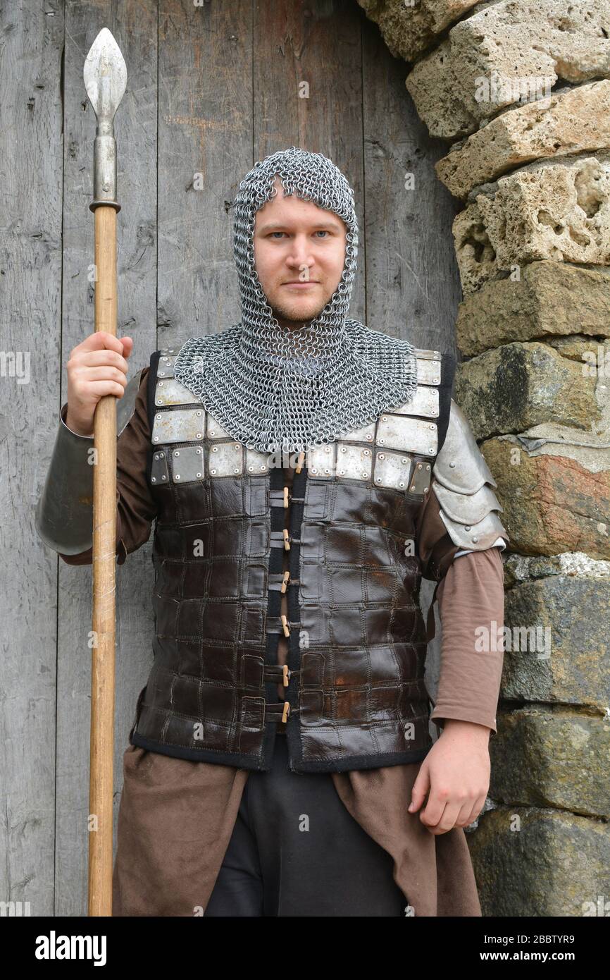 Reconstruction of the medieval scene, young knight with spear and ...