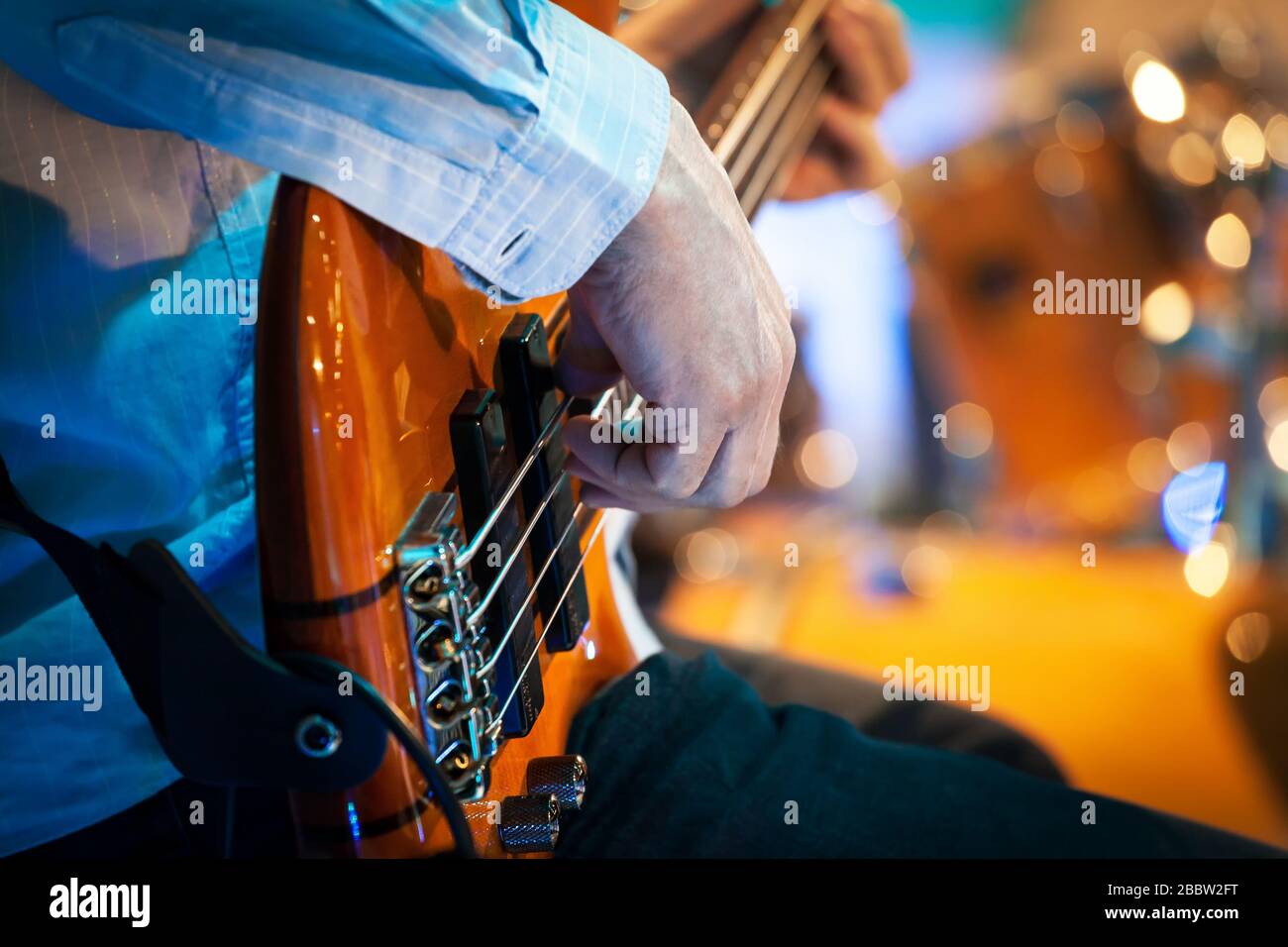 playing electrical bass guitar, closeup of hands and strings Stock ...