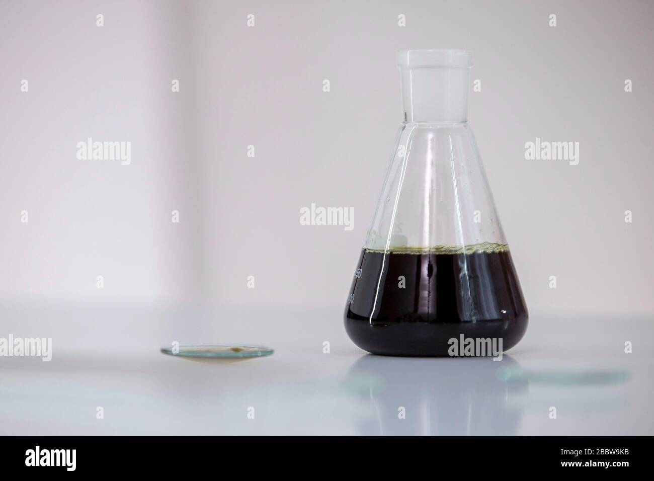 Female scientist in a laboratory working with cbd oil extracted from a ...